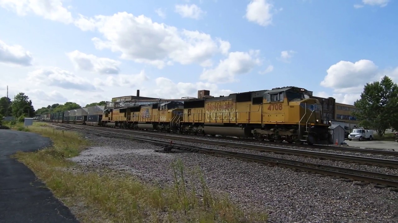 3 UP SD70M's lead a stack train with 4 UP arrowedge's east in Sterling ...