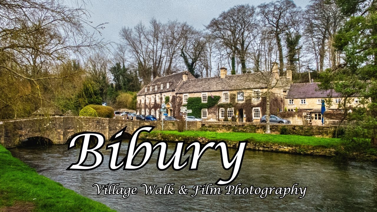 Old Street With Traditional Cottages In Bibury England Holiday