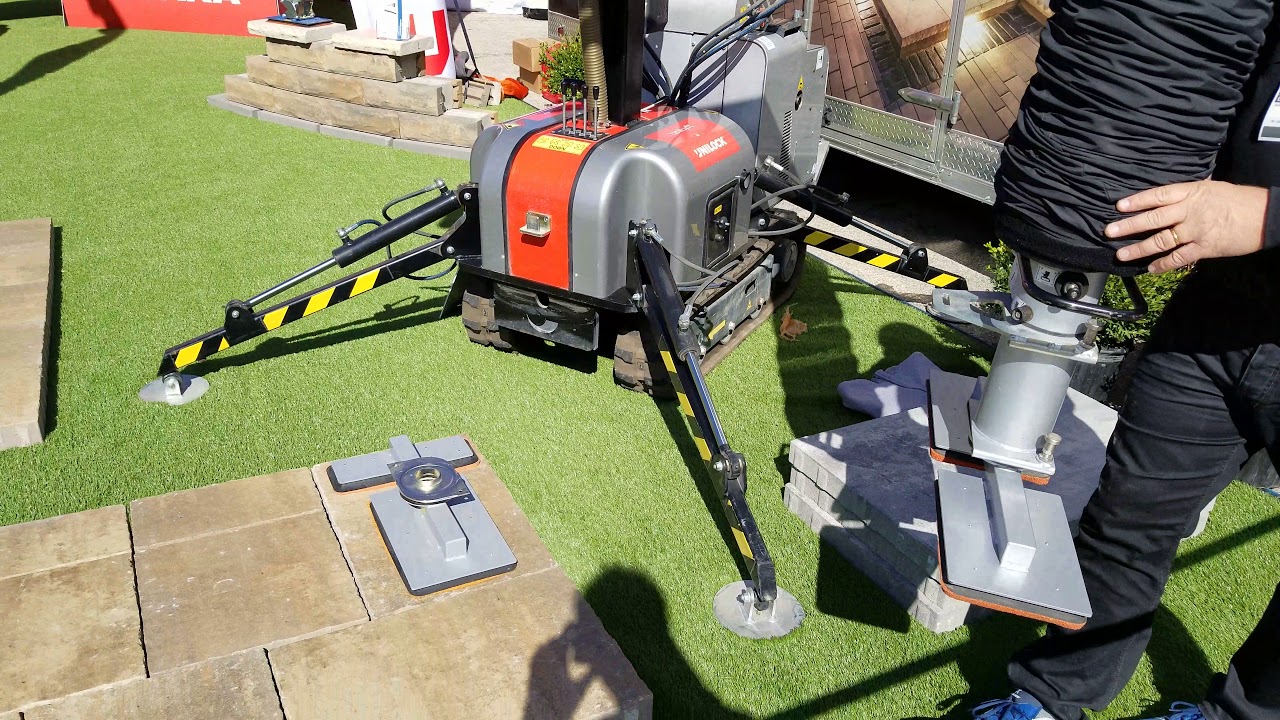 Unilock machine moving stone slabs with suction. AWESOME! - YouTube