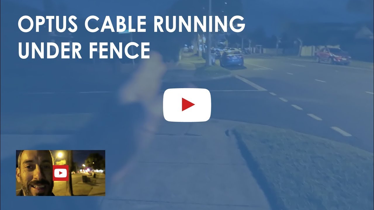Optus cable running under fence - YouTube