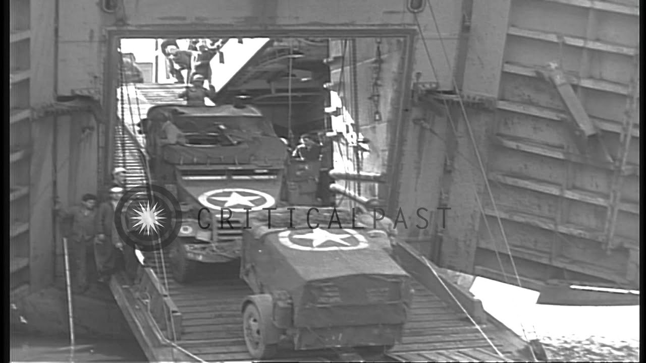 Loading of a US LST (Landing Ship, Tank) with army vehicles at Falmouth ...