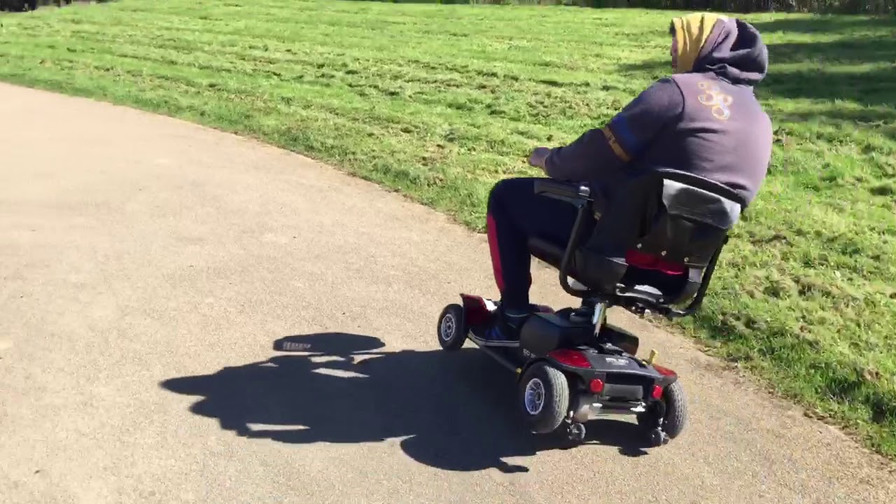 Mobility scooter on 2 wheels down hill pride go go - YouTube