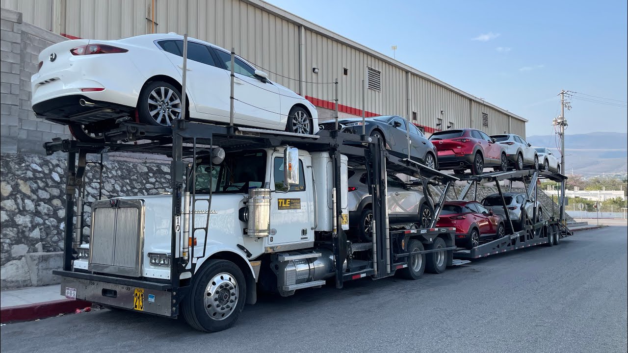 Car carrier off loading MAZDA - YouTube