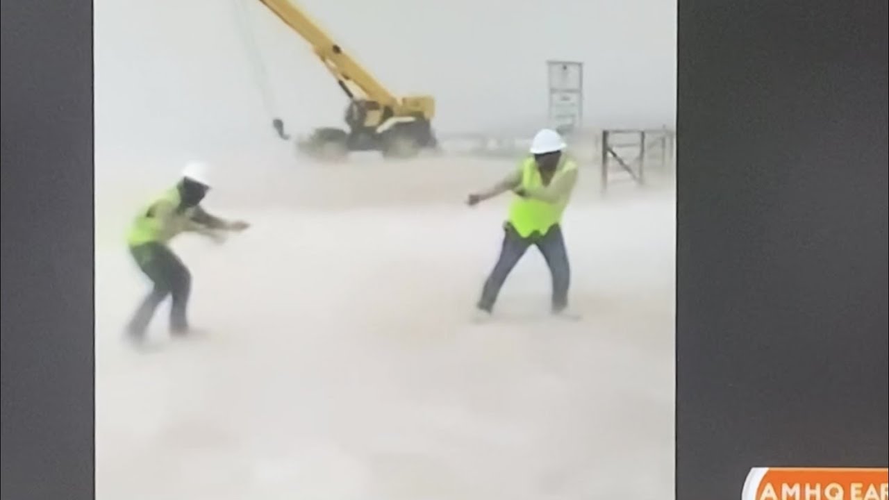 Construction Workers Battle High Winds - YouTube