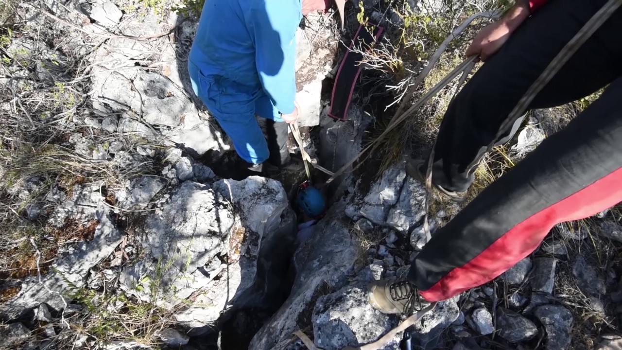 Escaping a very tight cave entry. - YouTube