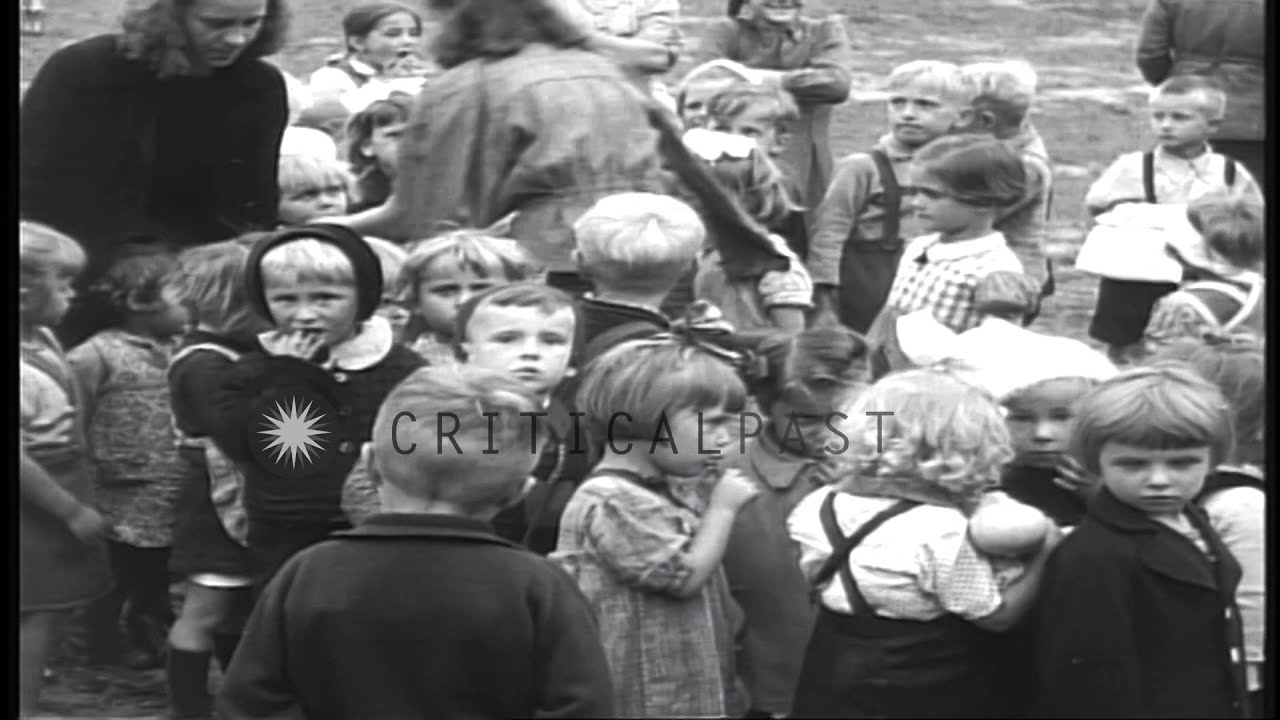 UNRRA workers instruct the disabled children at a camp in Wetzlar ...