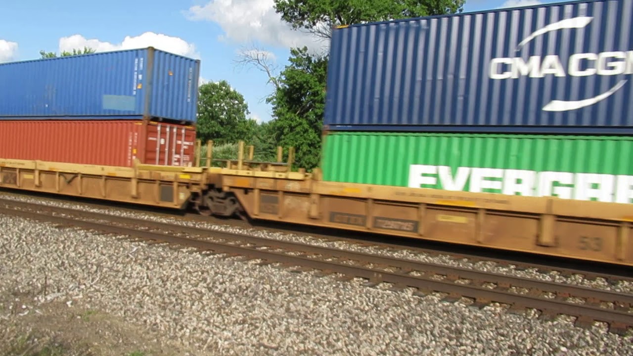 UP 8243, BNSF 5951 head East with auto rack & container train by ...