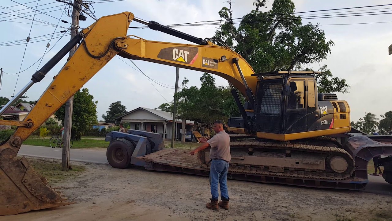How to side unload the excavator - YouTube