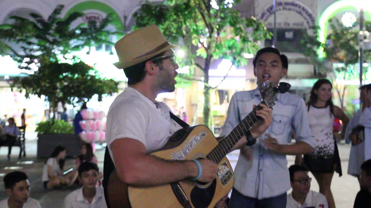 Singing in Vietnamese on the Streets of Saigon, Vietnam with twenty ...