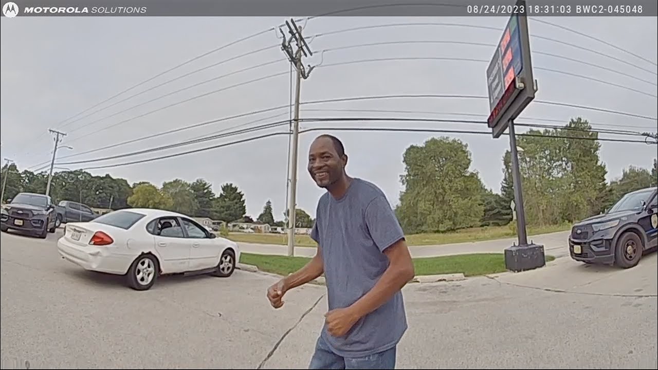 Suspect Pretends to Run From Officers While Detained - YouTube