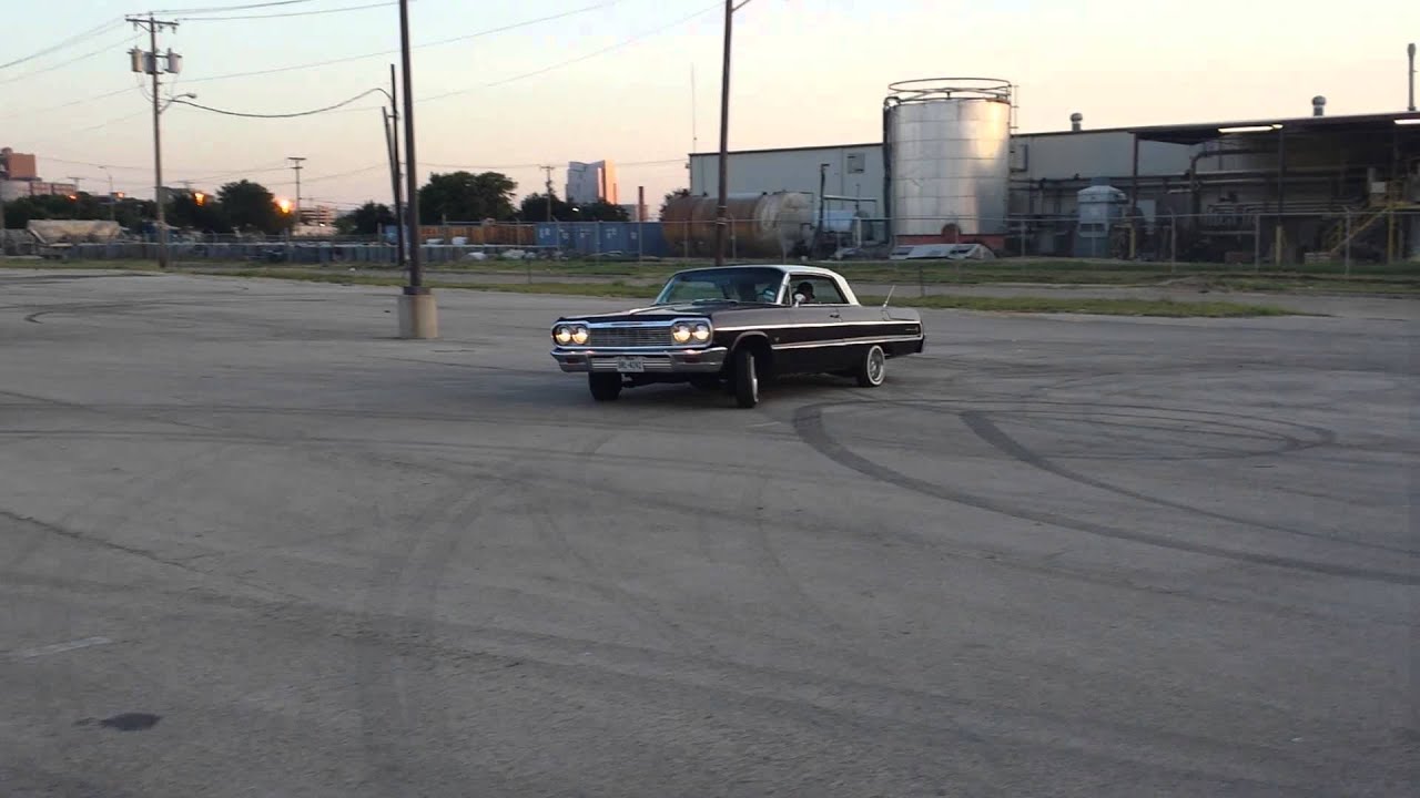 64 impala hitting 3 wheel on air ride - YouTube