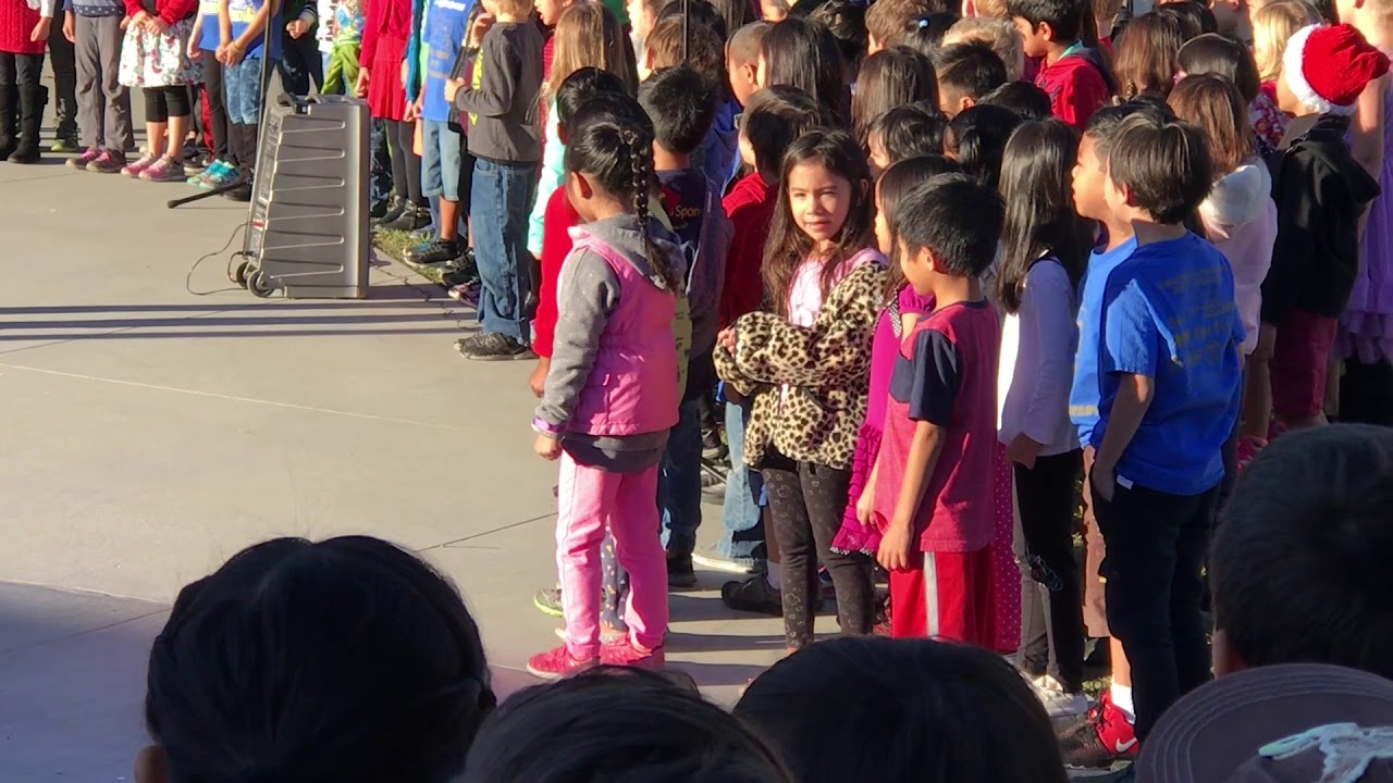 First Graders at Ericsson Elementary School sing "Its a grand old Flag ...