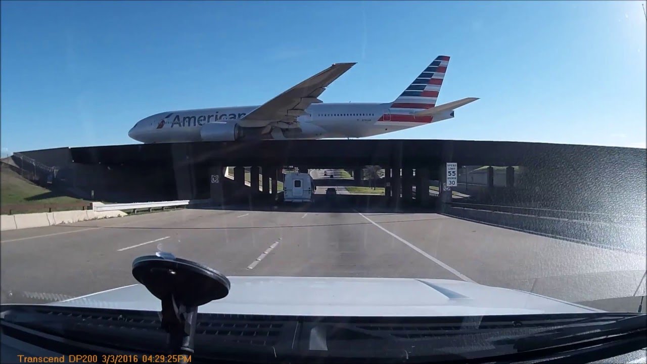 American Airlines Plane Cruises Over Bridge - YouTube