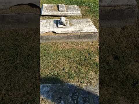 grave slab sliding off top gravestone in cemetery - YouTube