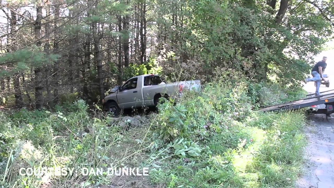Truck wraps around tree - YouTube
