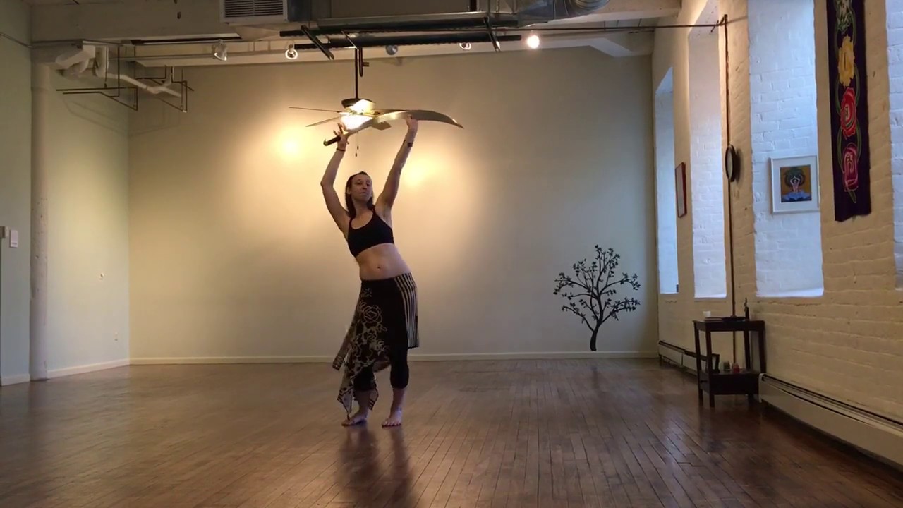 Belly dance sword practice at One Love Yoga - YouTube