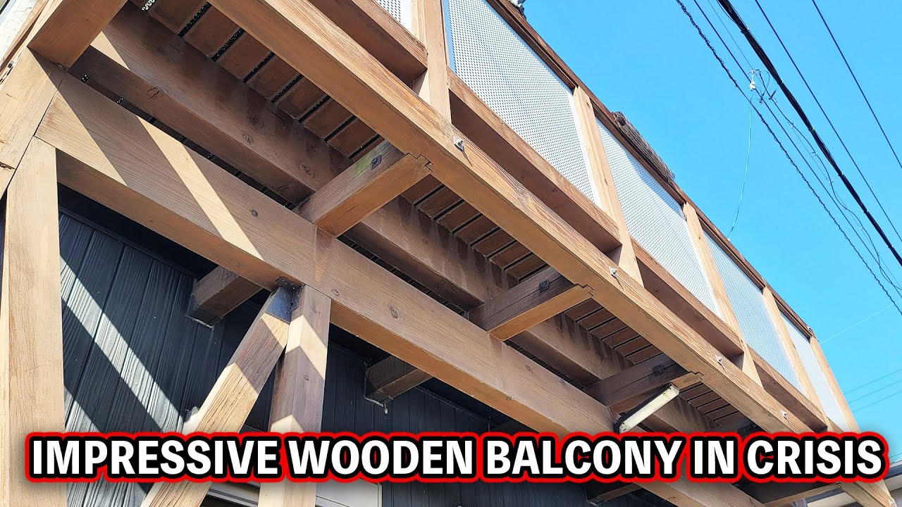 Beautiful wooden balcony. The veranda exposed to the rain needs ...