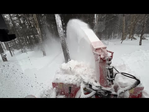 Snowblowing through deep snow in the forest. TYM T474 and Pronovost ...
