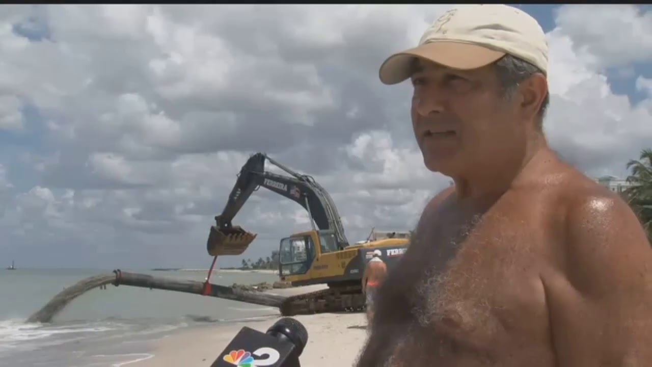 Large pipe pumps sand onto Naples Beach - YouTube