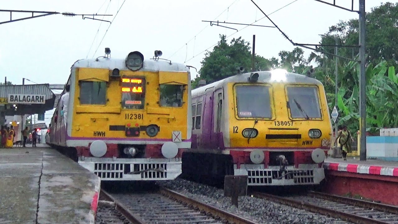 Perfect timing local trains crossing in heavy rain! - YouTube
