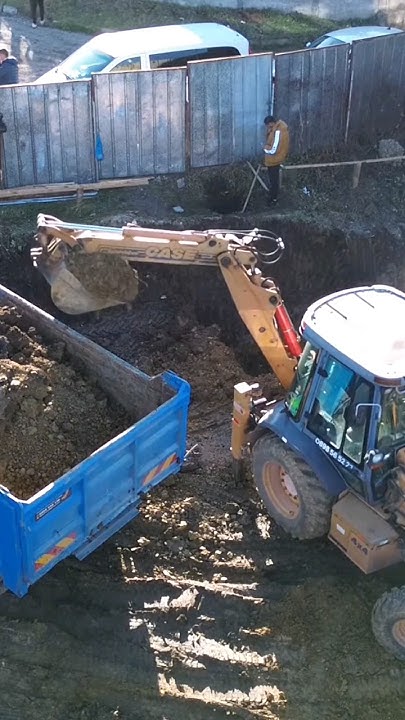 CASE backhoe digging foundation - YouTube