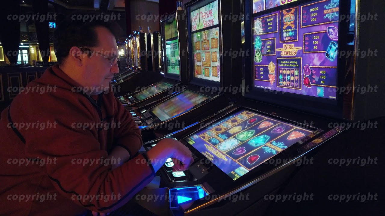 Man playing slot machine in casino - YouTube