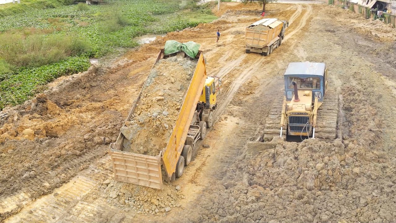 Komatsu Bulldozer D60p & Dump Trucks 25t Filling Land project ...