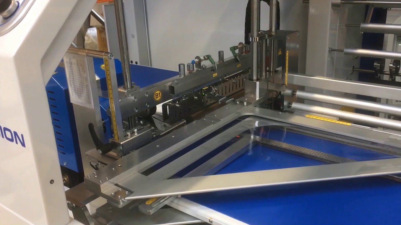 Audion Packaging machines - CS Matic 100 shrink packing masks - YouTube