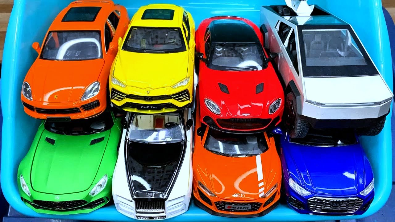 Box full of various miniature cars Jaguar, Peugeot, Renault, Hyundai ...