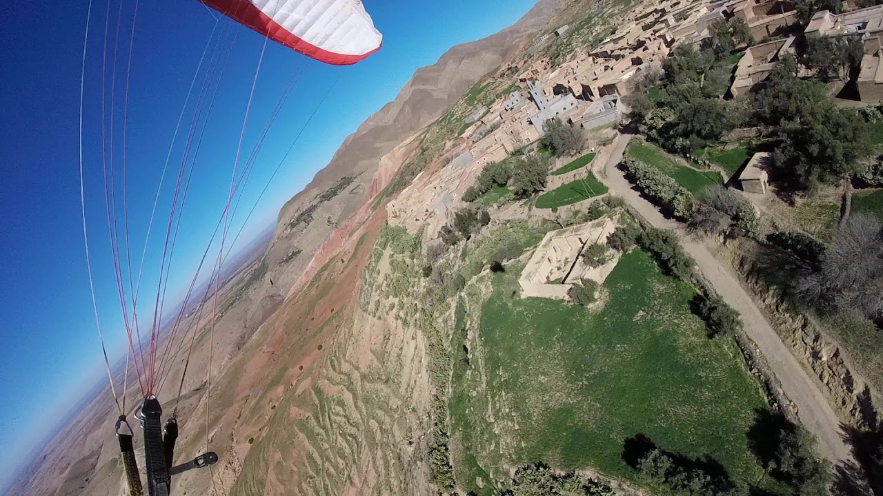 Paragliding Morocco flying over a village - YouTube