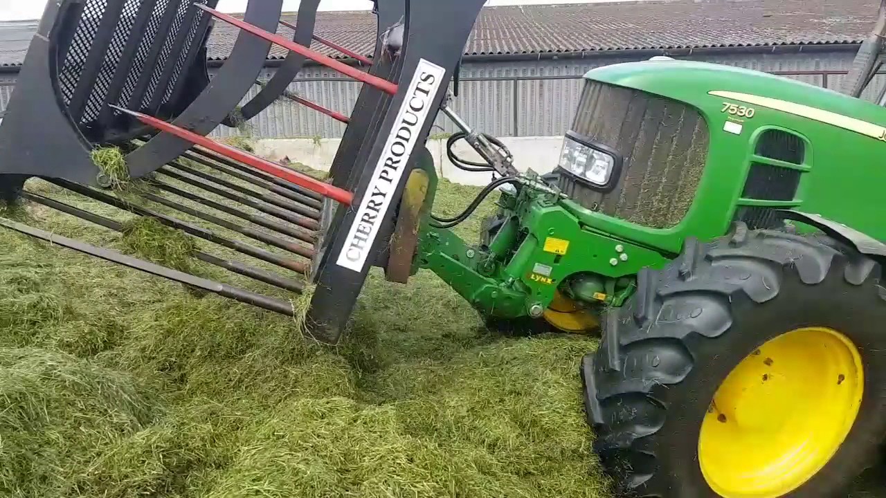 Carting grass and a bit of 8830 action - YouTube