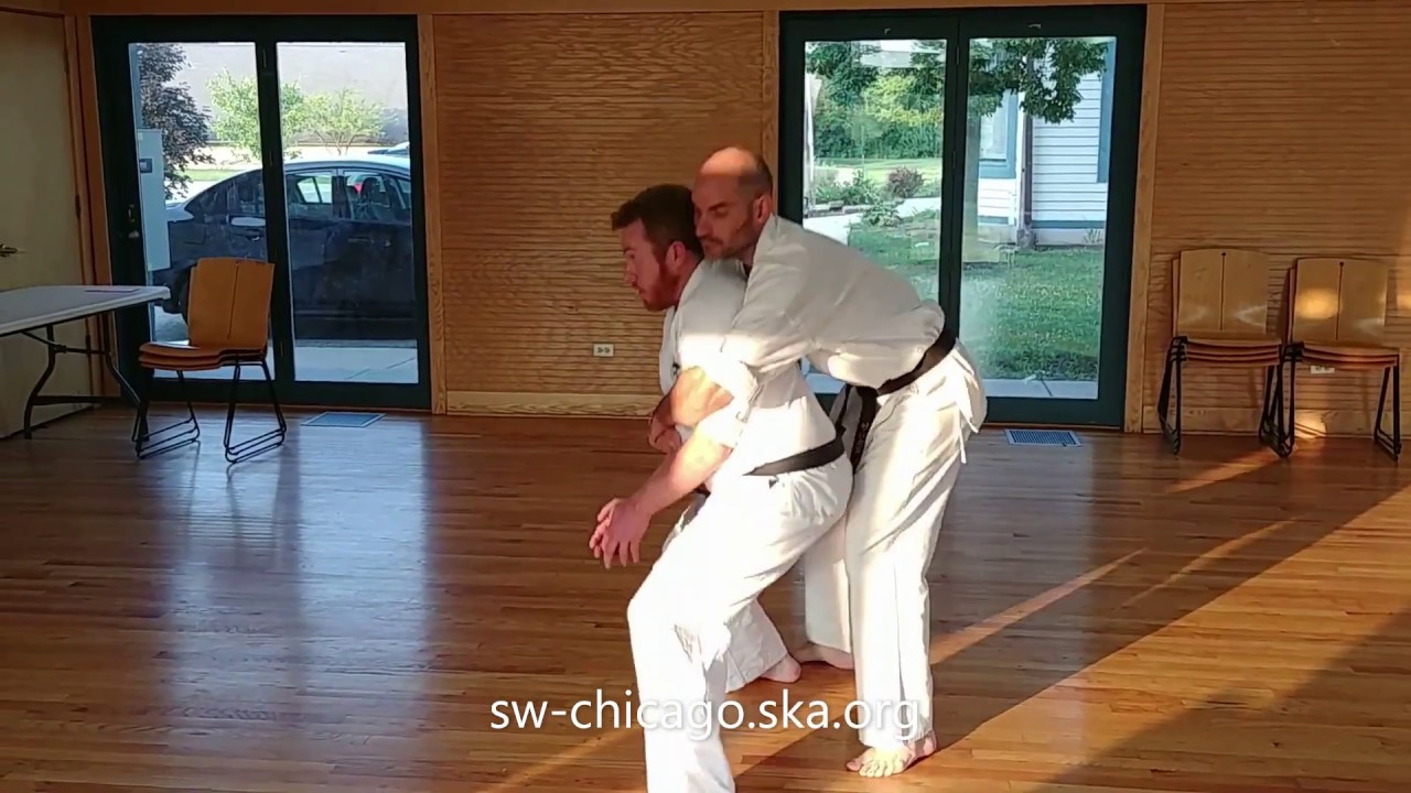 How to escape a grab from behind - YouTube