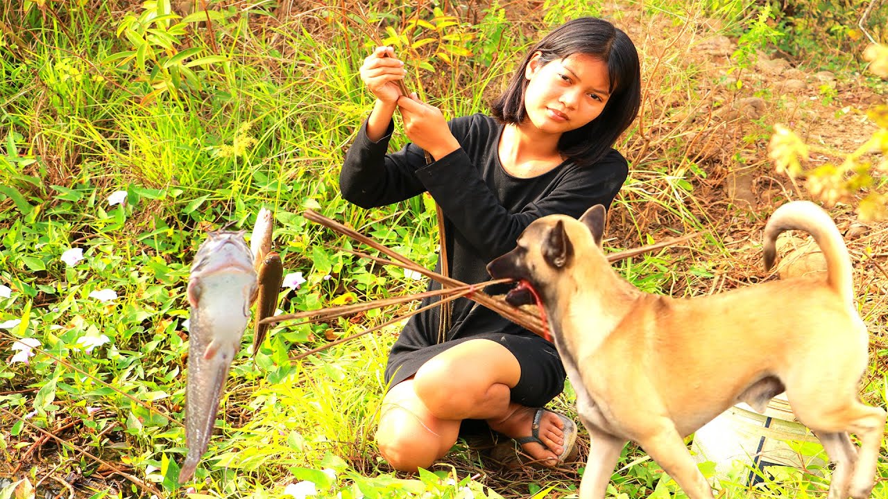 Girl catch fish with dog - YouTube