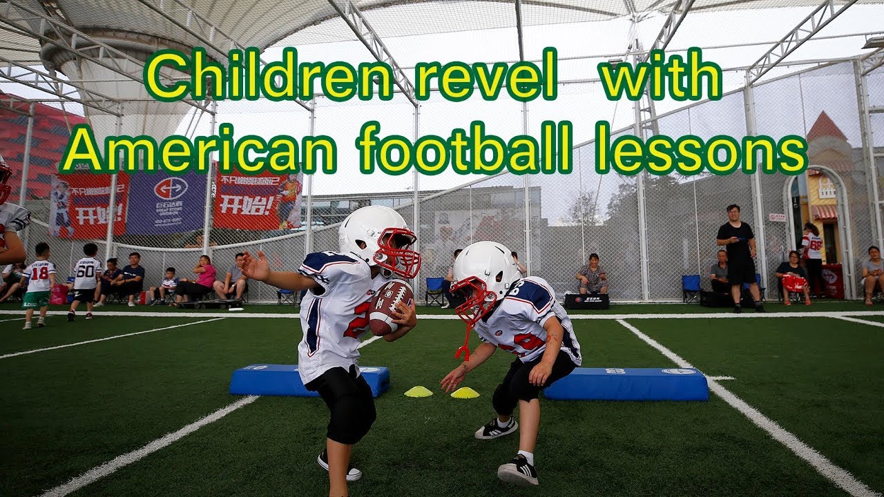 Children revel with American football lessons - YouTube