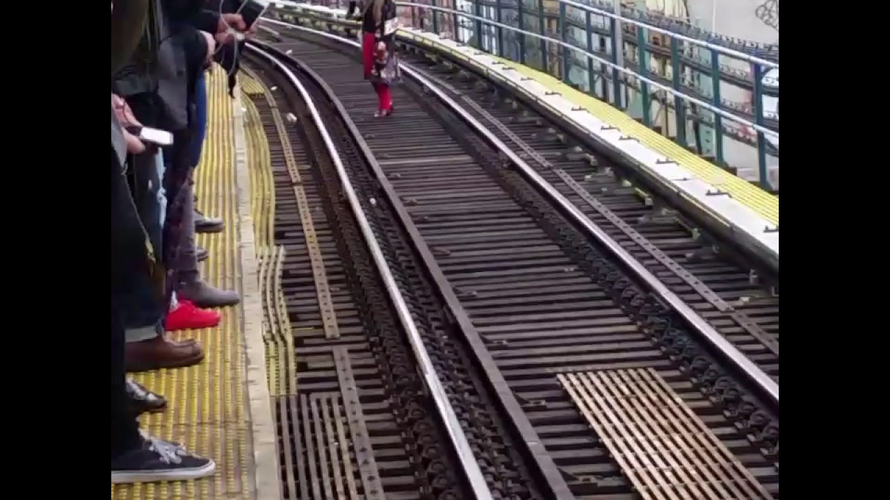 Woman walking on Brooklyn subway tracks at Myrtle & Broadway, 3/1/2017 ...