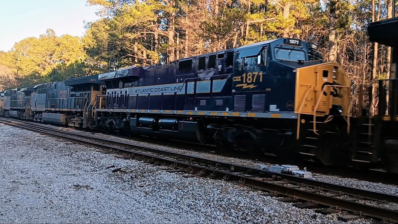 CSXT 3266 leads M693 with the ACL Heritage unit trailing leaving Greenwood SC for Augusta Ga ...