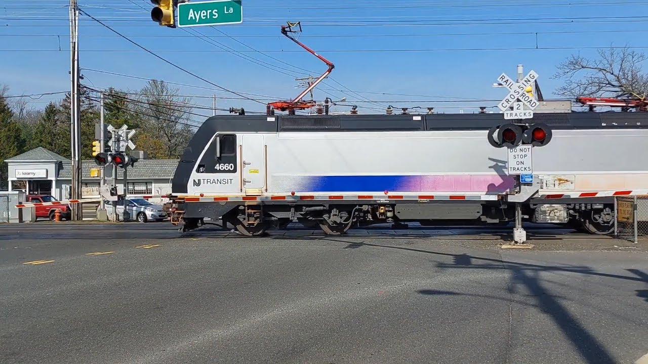 NJ Transit train roars through busy Little Silver Railroad Crossing ...
