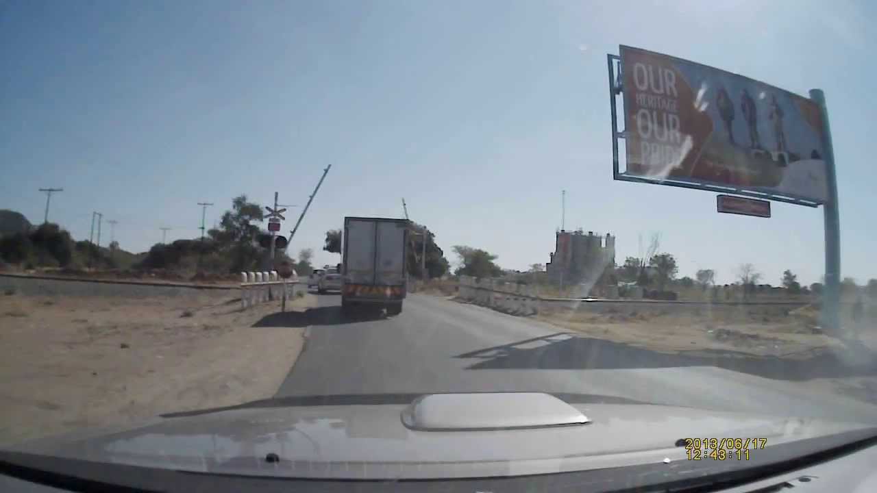 Diesel train crossing road in Gaborone, Botswana - YouTube