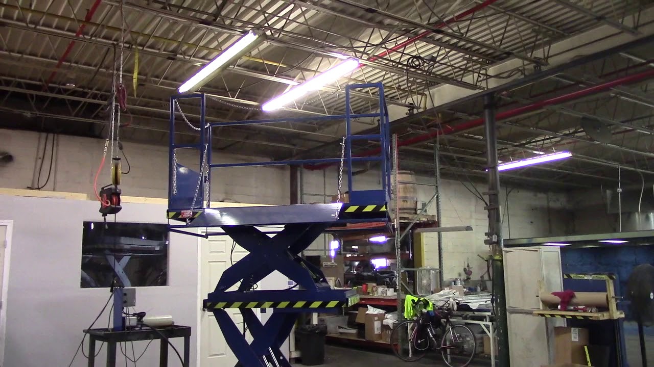 VERTI-LIFT DOUBLE SCISSOR OPERATOR LIFT - YouTube