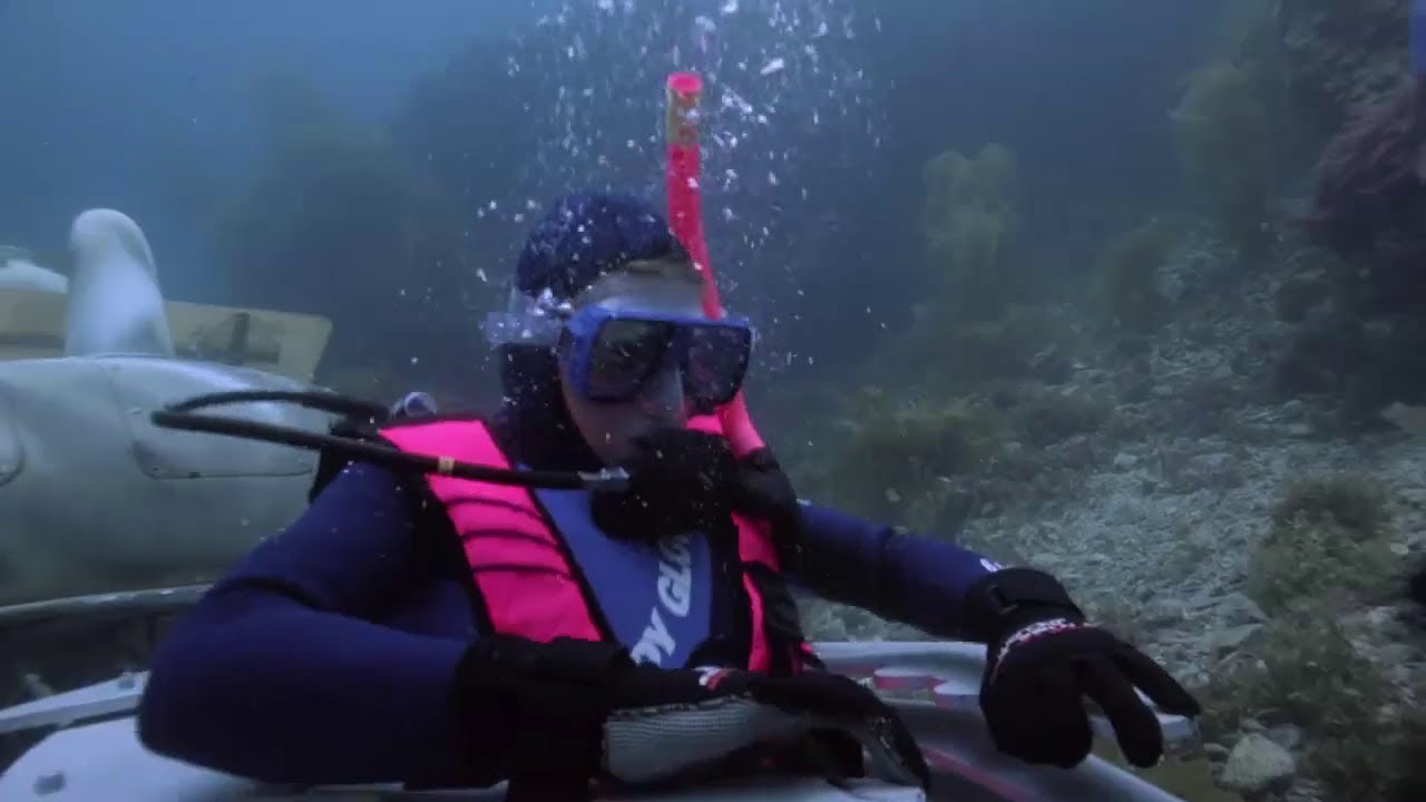 A female diver explores a cave and gets attacked by a submarine ...