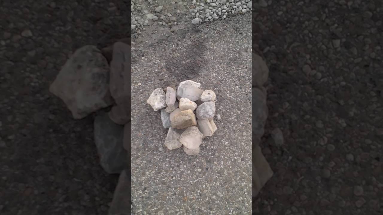 trying to break a 10 pound rock on street #1 - YouTube