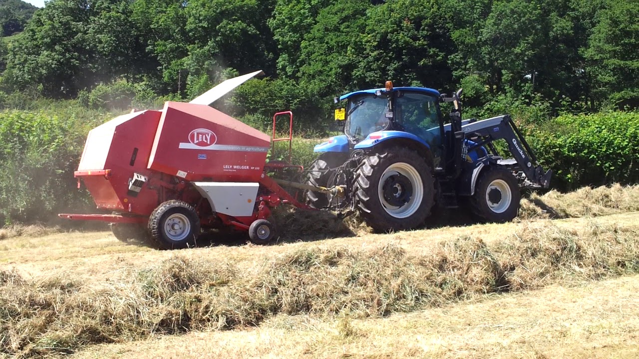 New Holland T6020 with Lely Welger RP 235 Round Baler - YouTube