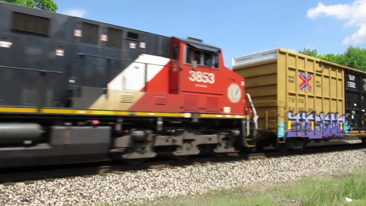 CN 3078, 3853 hurry a Westbound mixed freight car train + GACX Agrium ...