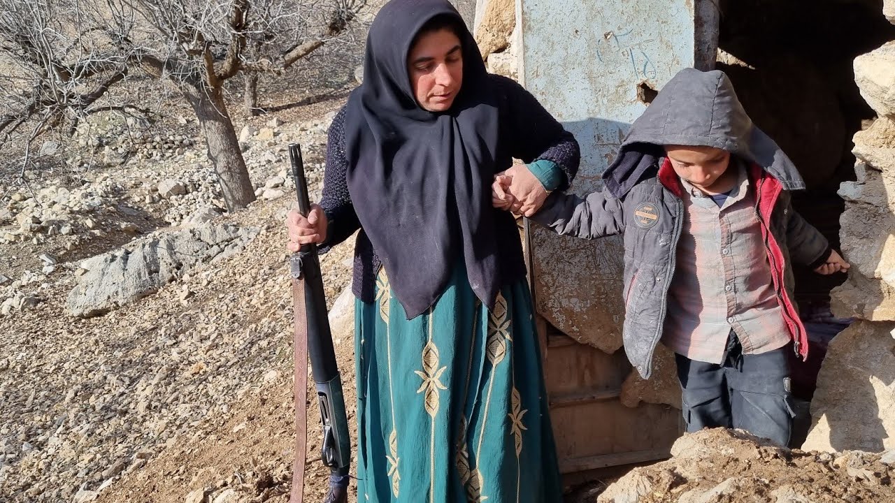 Nomadic Routine: Bathing the child by the nomadic woman and washing the ...