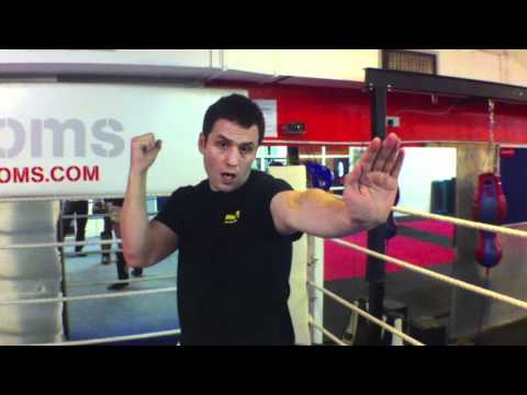 Muay Thai Minute -Long Arm Jab Defense- Muay Thai Techniques
