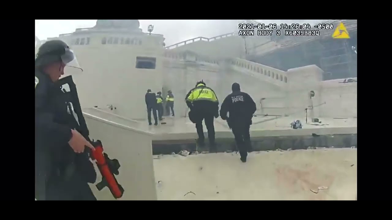 J6 2:25 Officer “Rich” launches a cs gas round into the scaffolding ...