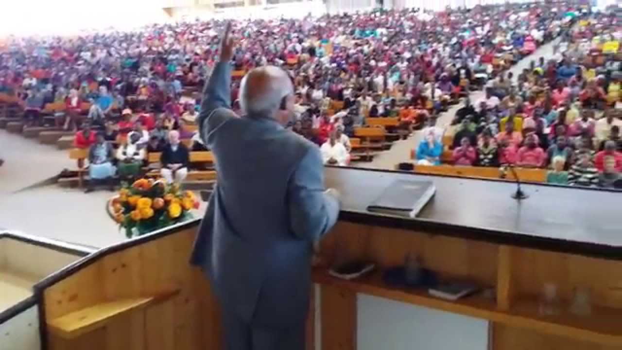 Pastor Joseph Chauke leading singing at Kwasizabantu Youth Conference ...