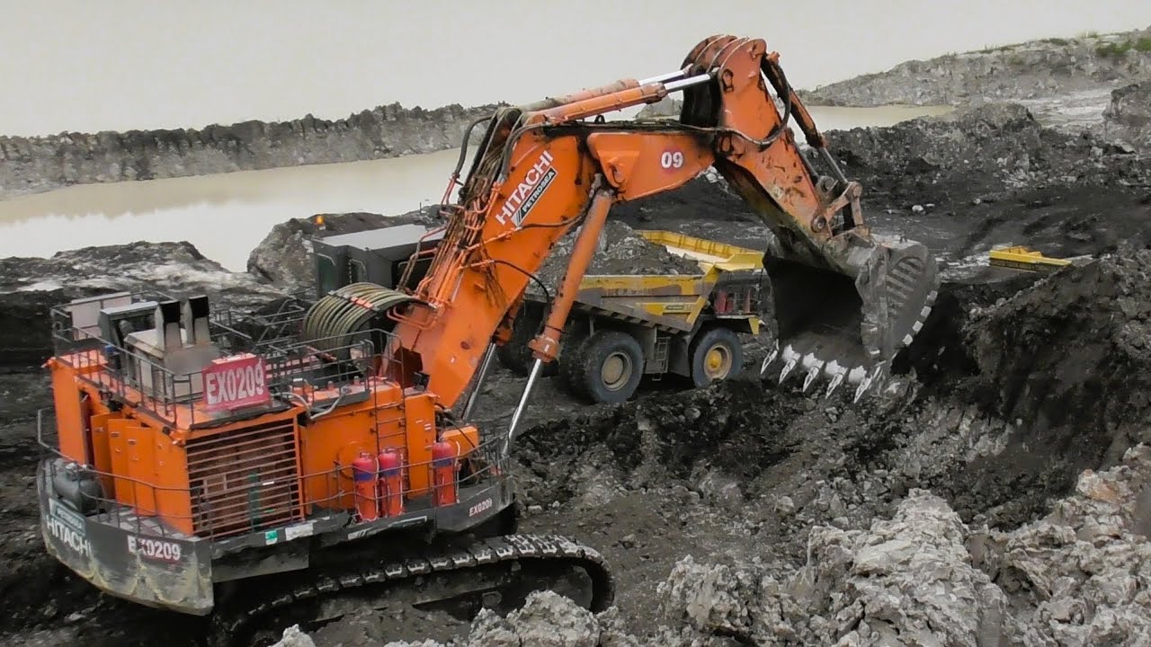 Top View of Hitachi EX2600 Excavator Loading Overburden into Komatsu ...