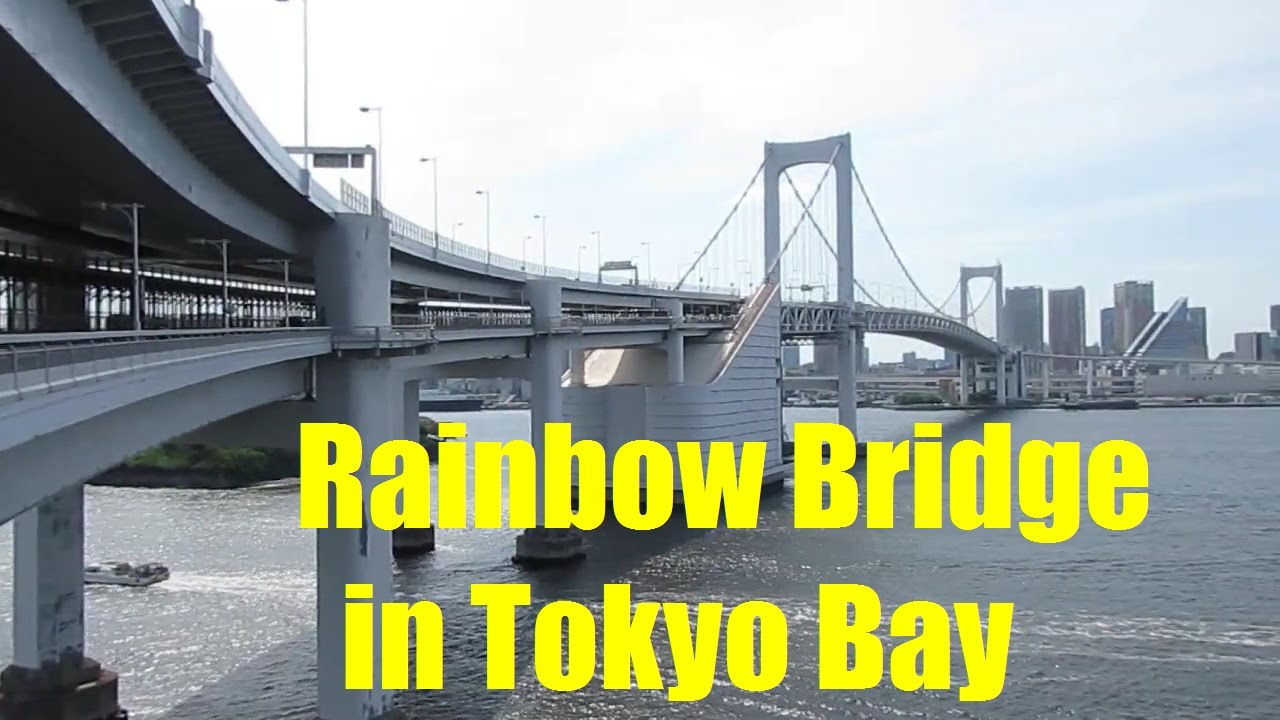 Walking across the promenade on Rainbow Bridge in Tokyo Bay, JAPAN ...