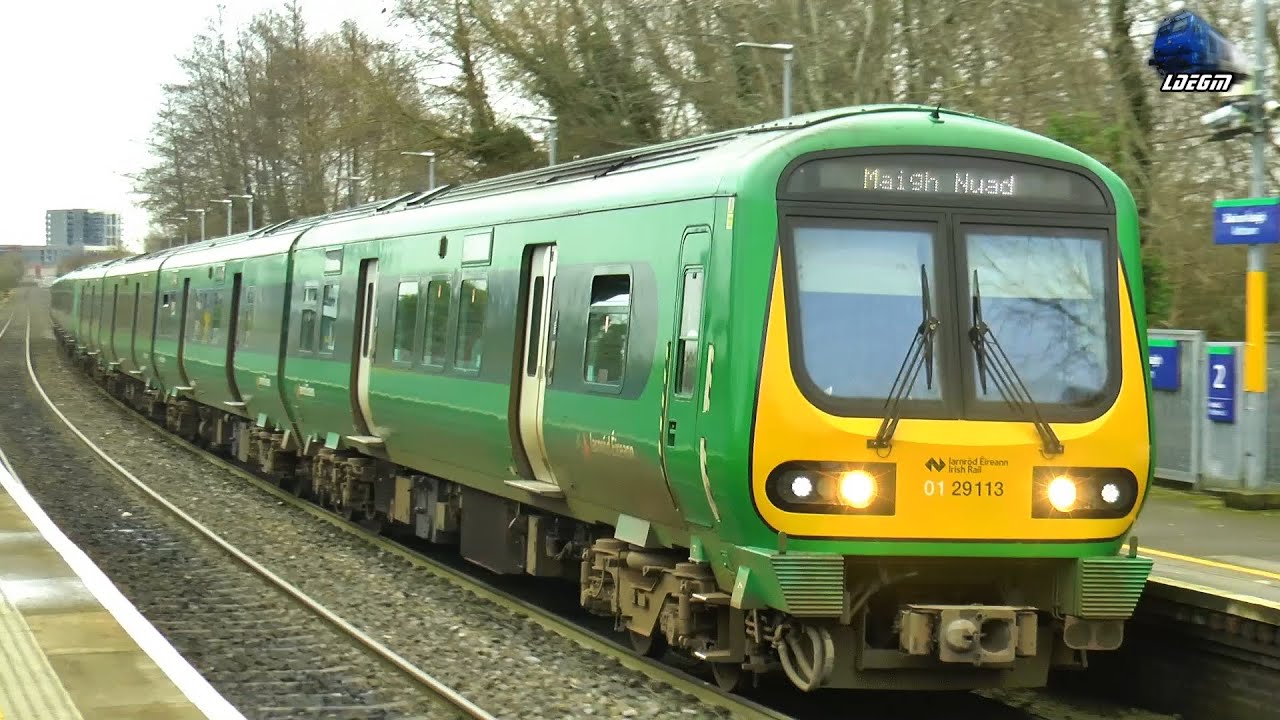 Trains and Manual Railroad Crossing in Ashtown Train Station, Dublin ...